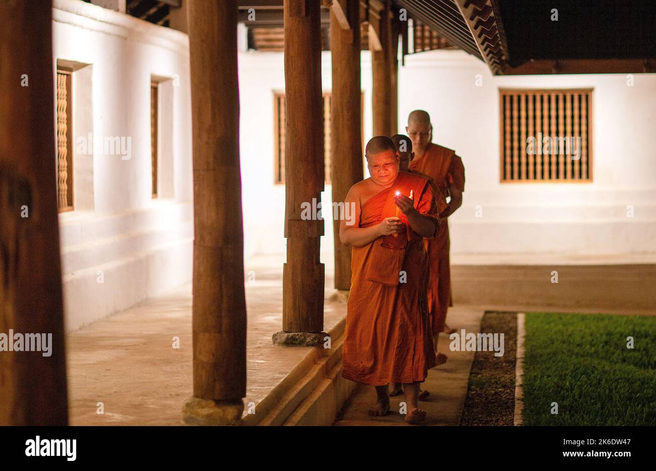 Chiang Mai, Thailand. 13th Oct, 2022. Thai Buddhist monks hold candles ...