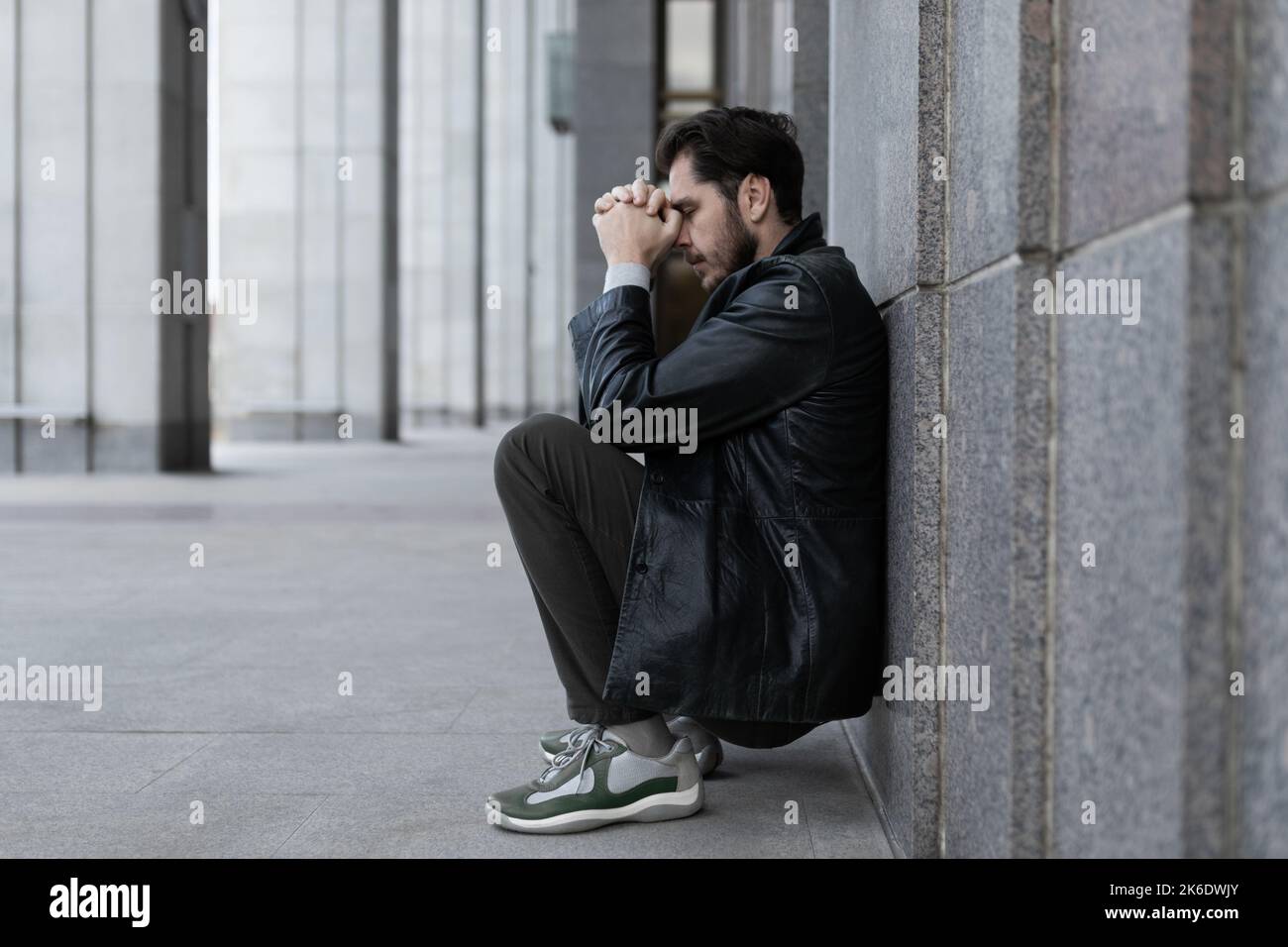 a man at the moment of apathy and loss of interest in what is happening ...
