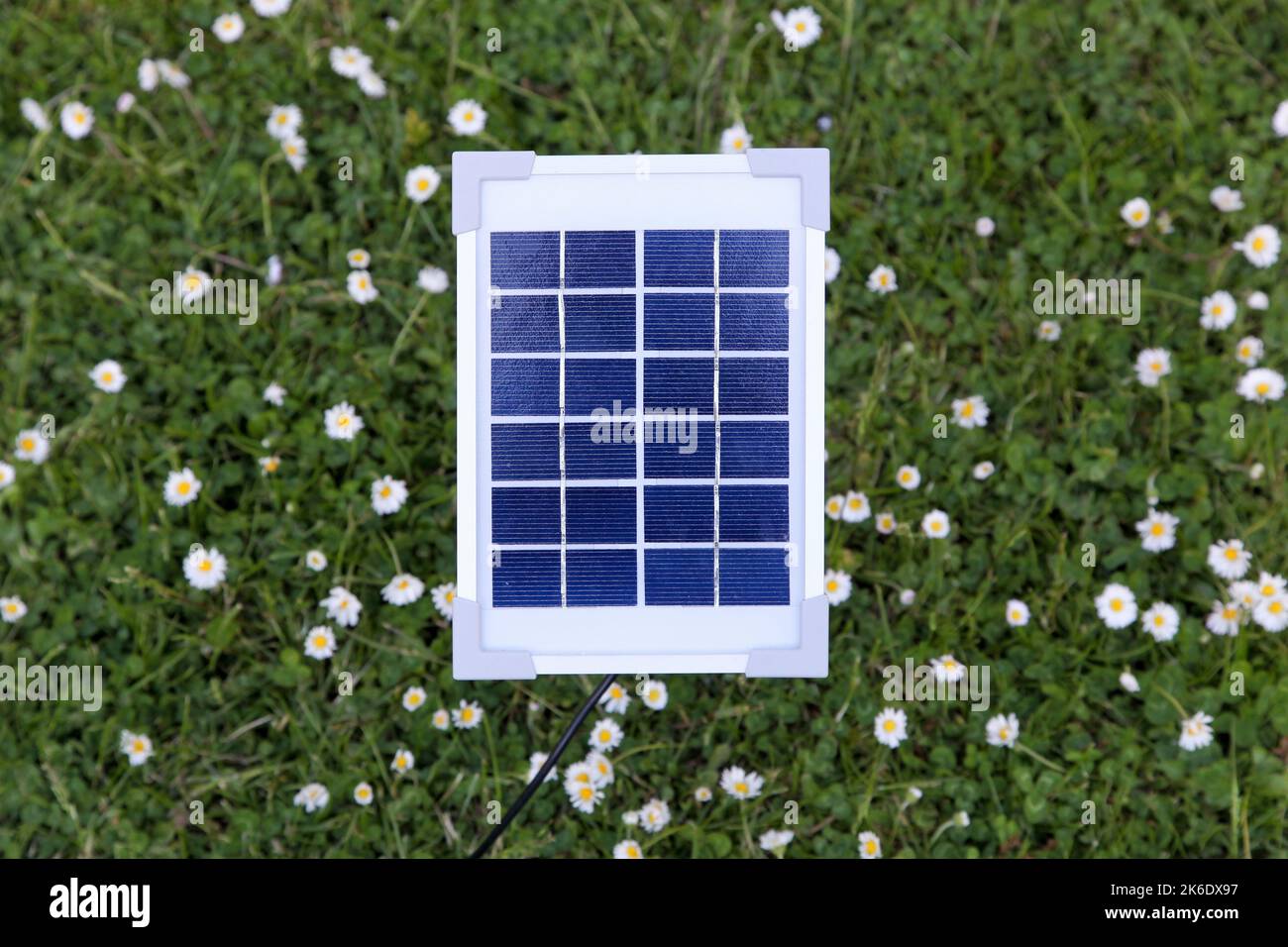 Small solar panel in a garden Stock Photo - Alamy
