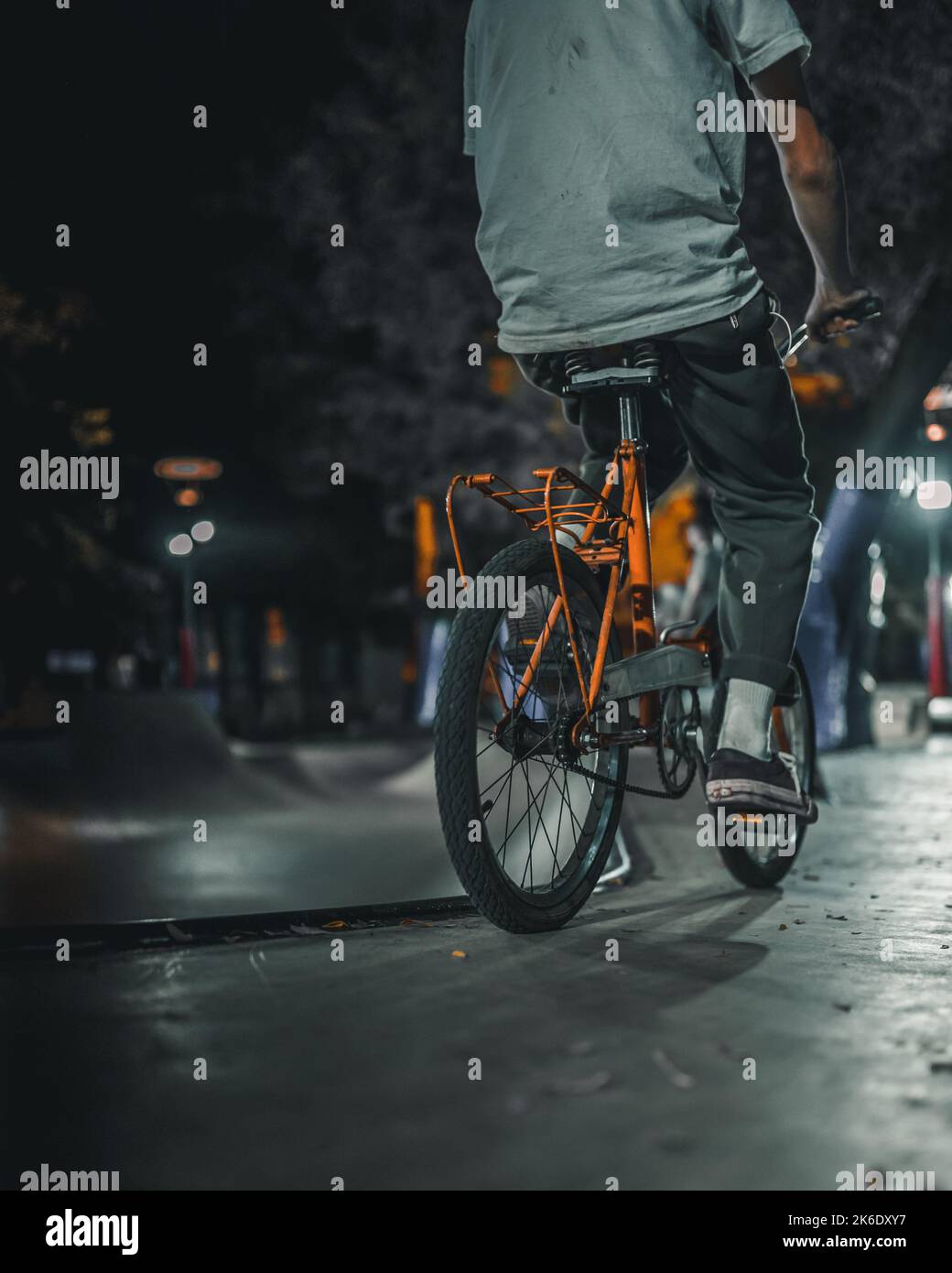 Budapest bokeh night lights on the street with a male in front riding ...