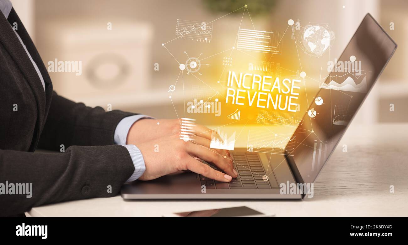 Side view of a business person working on laptop Stock Photo - Alamy