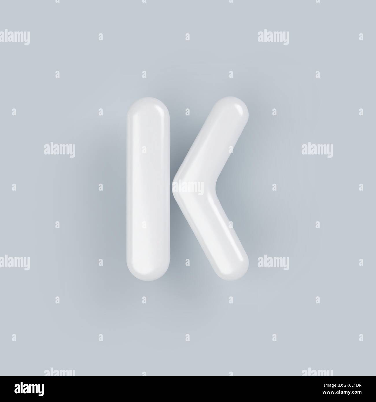 3D White plastic uppercase letter K with a glossy surface on a gray ...