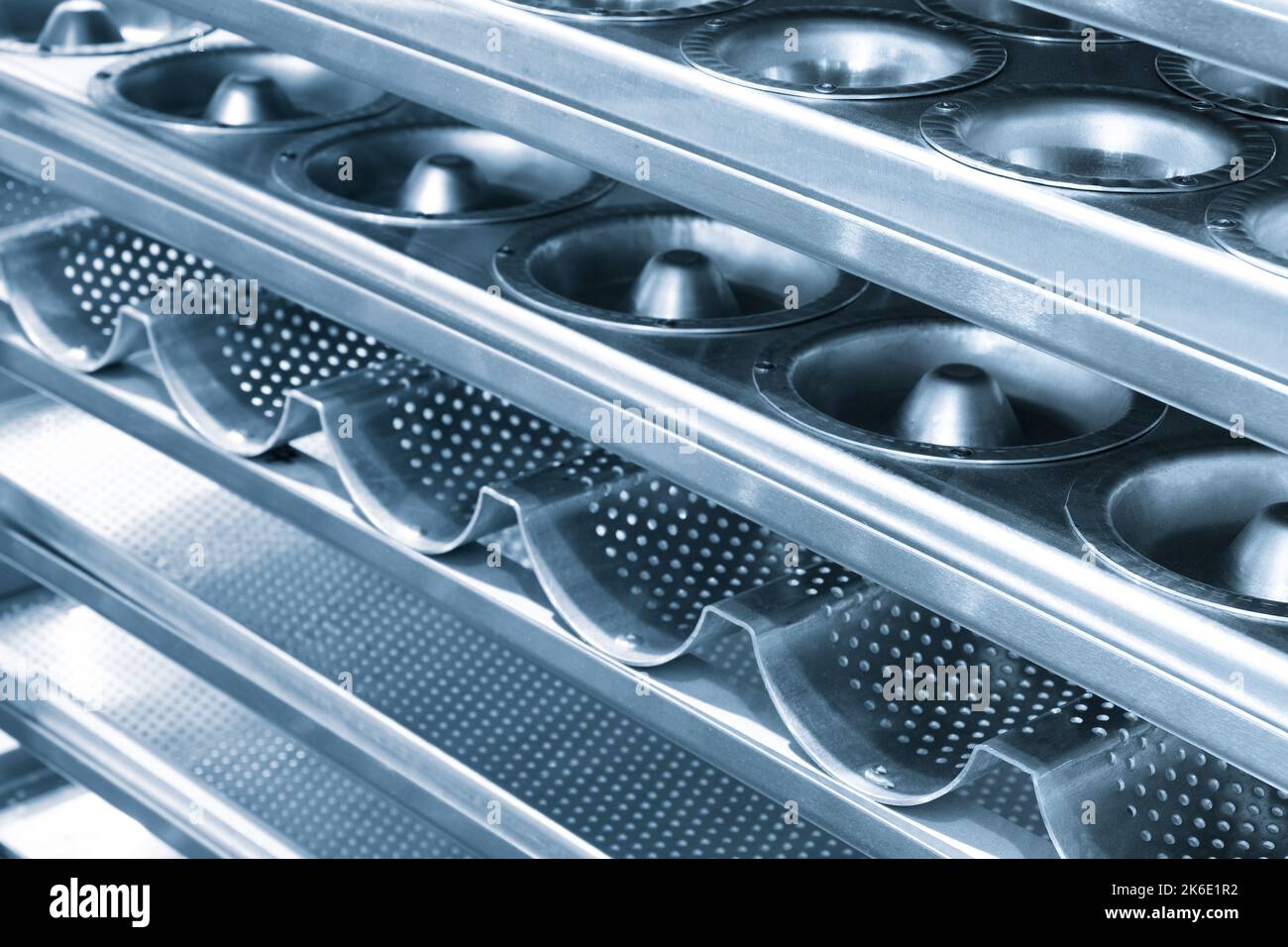 Rack with metal containers for cooking food Stock Photo - Alamy