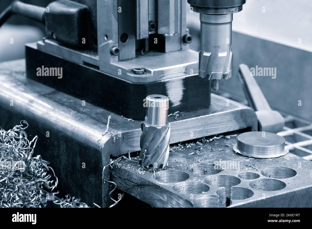 The Hi-precision CNC milling machine with cutting sample in blue-silver ...