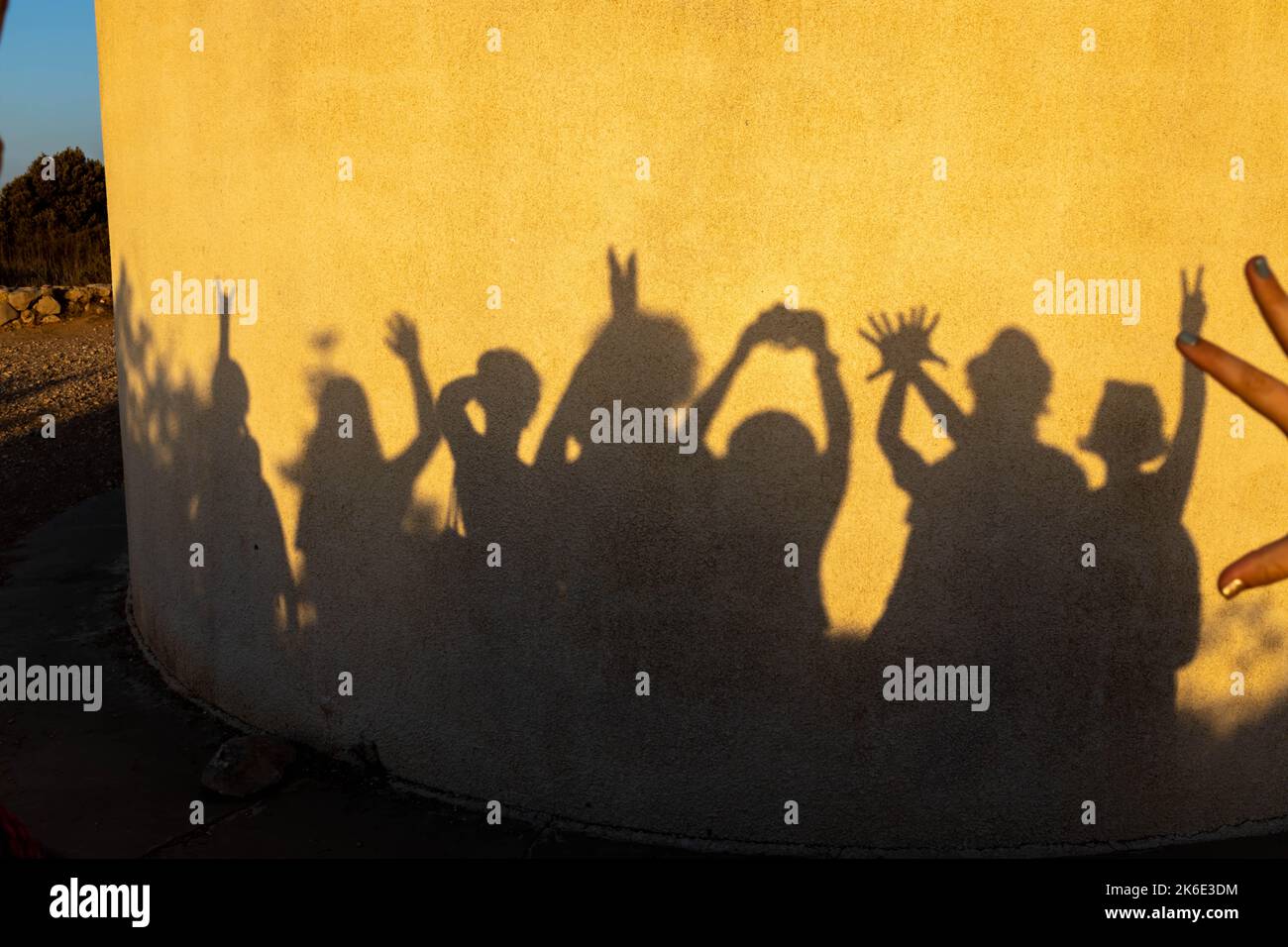 View of a fun photo of a group of friends making poses creating a ...