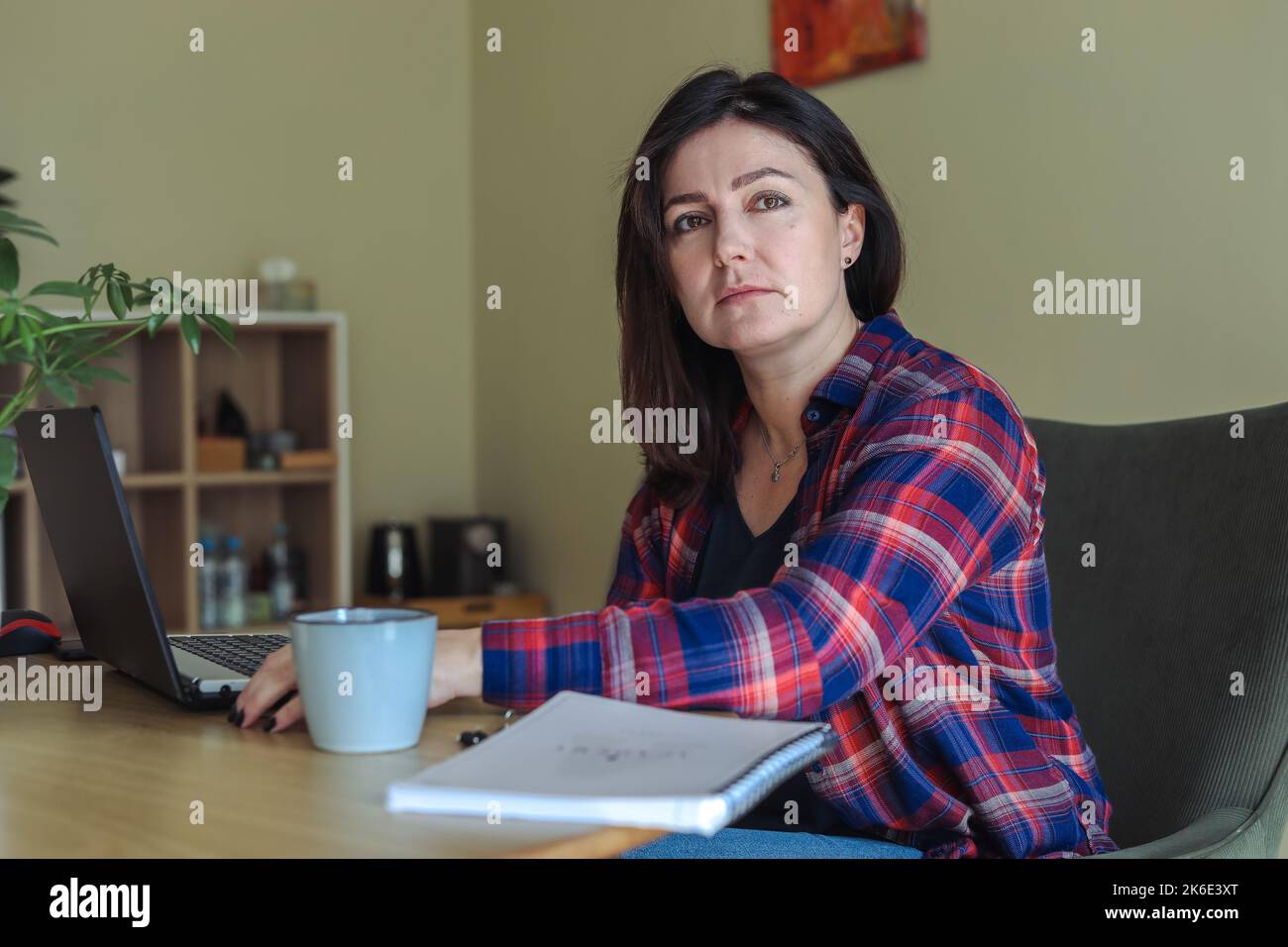 Calm Silent Tired Stressed And Thoughtful Dark Haired Woman Use Laptop