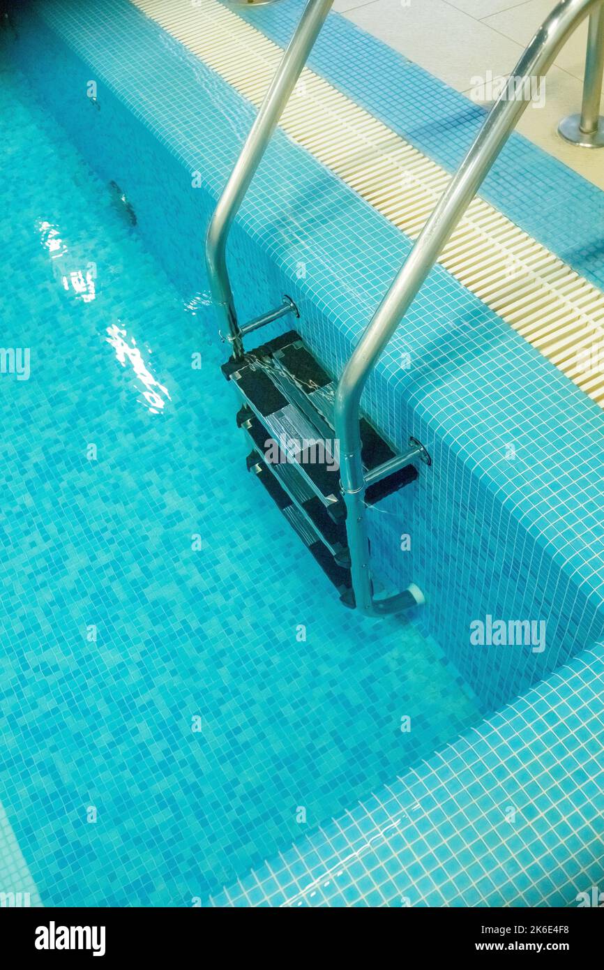 Pool ladder with stairs in empty pool for sport swimming training in ...