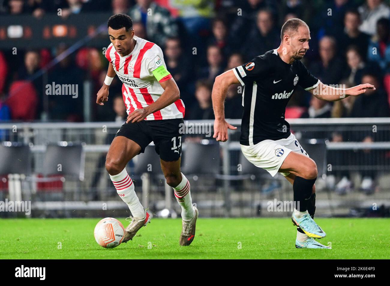 EINDHOVEN - (lr) Cody Gakpo of PSV Eindhoven, Nikola Katic of FC Zurich ...