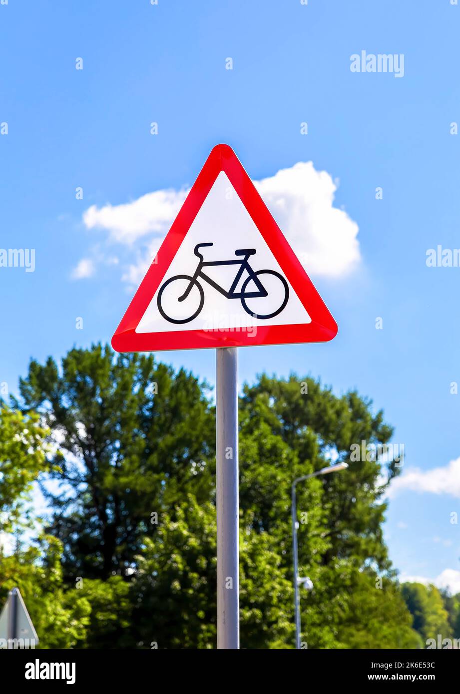 Triangle bicycle road sign for bikes lane against the blue sky Stock ...