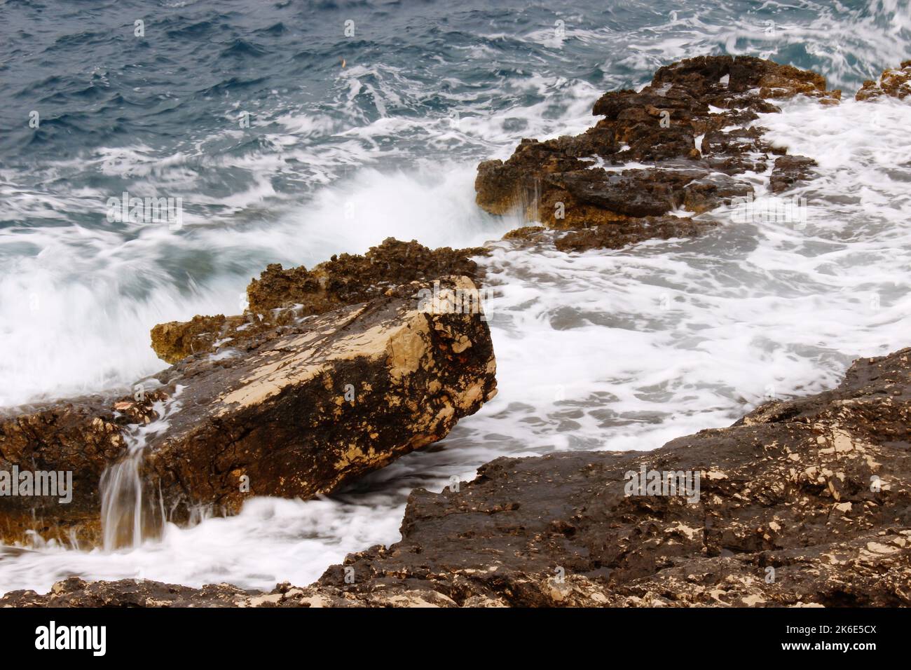 Coast rocks splashed by sea waves Stock Photo - Alamy