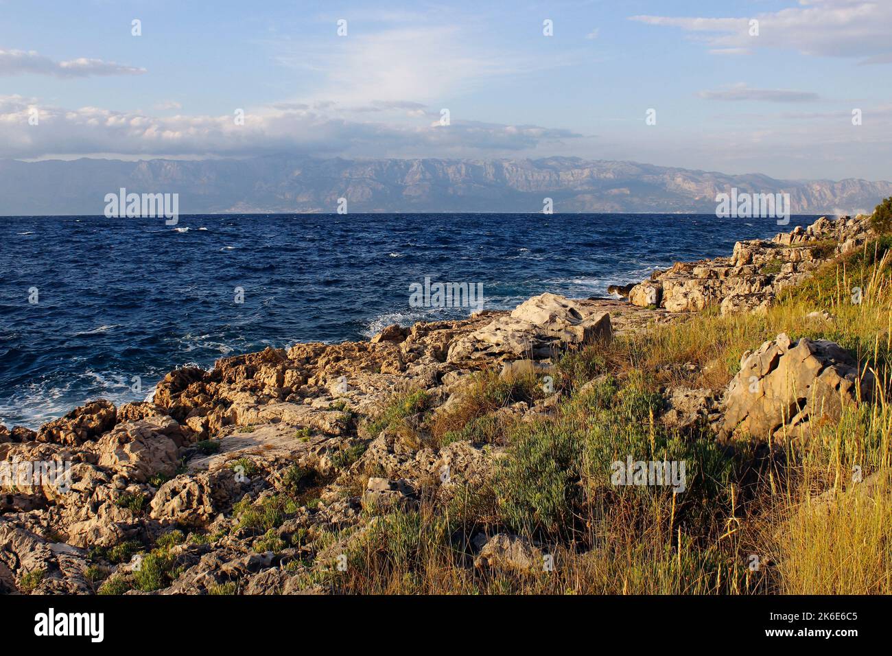 Rock shore with sea waves Stock Photo - Alamy