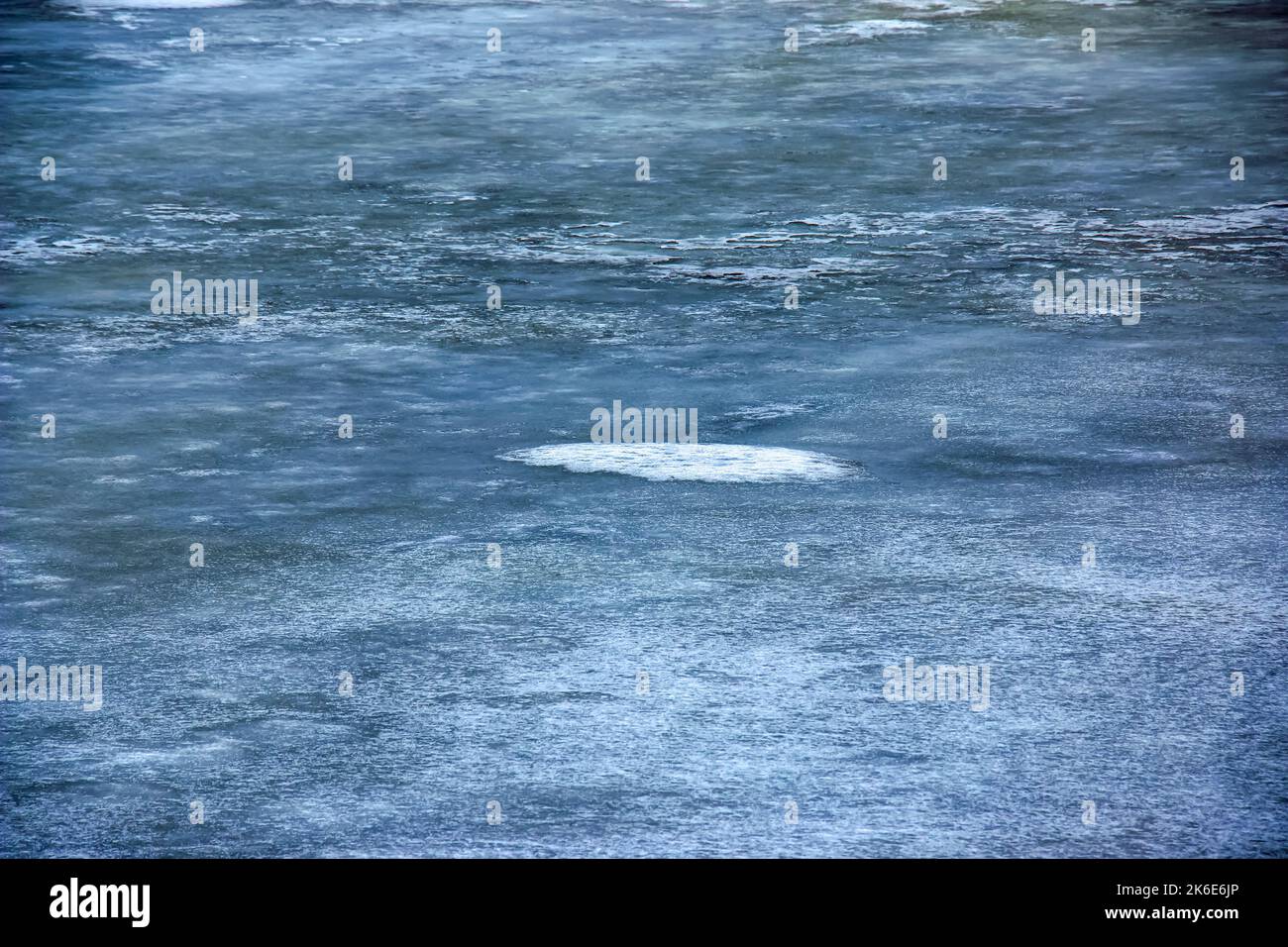 Winter background of the icy surface of the river. Texture of ice ...
