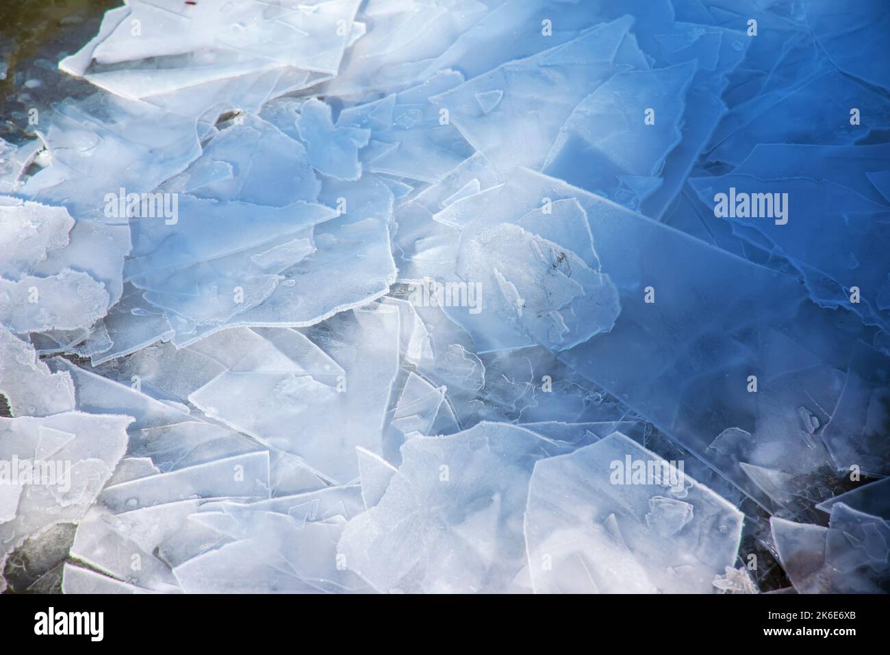 Winter background of the icy surface of the river. Texture of ice ...