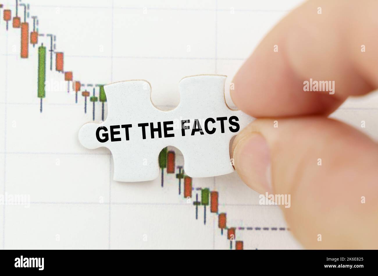 Business concept. Against the background of the quotes chart, a puzzle ...