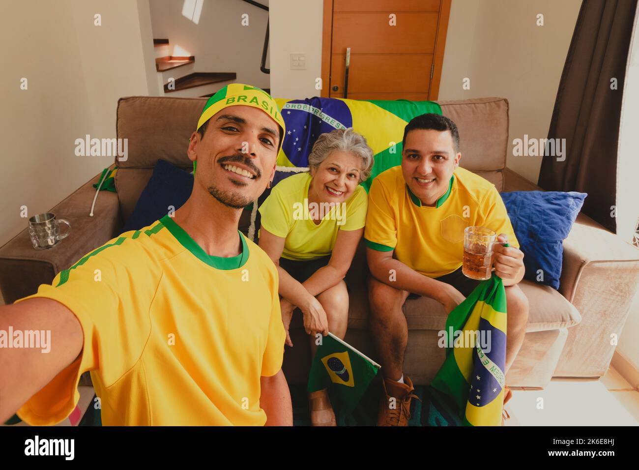 Brazilian Mixed Race Family Celebrating the cup in the living room ...