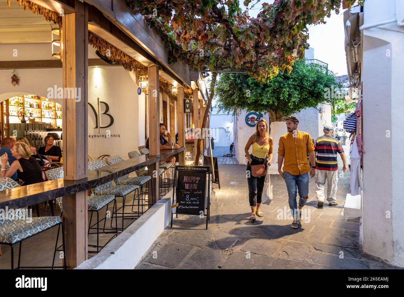 Tourists Walking at night through the Streets of Lindos Rhodes Greece ...