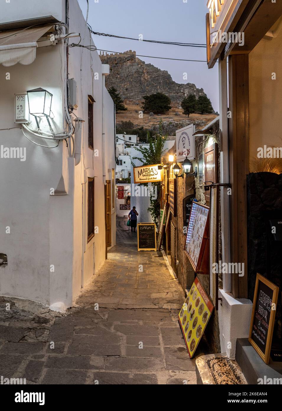 Tourists Walking at night through the Streets of Lindos Rhodes Greece ...