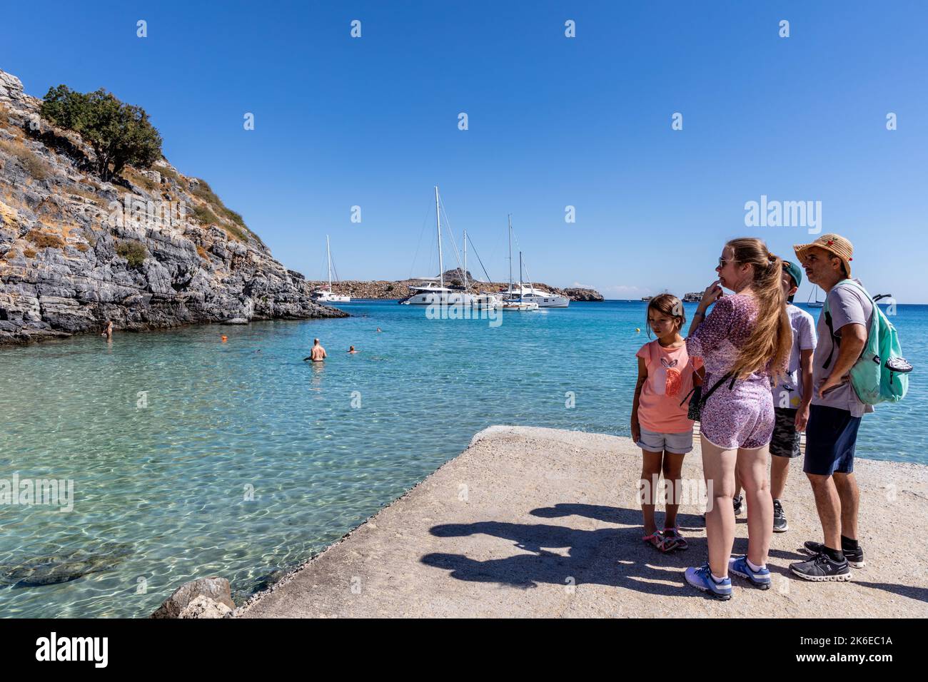 Tourists Standing On the Long Beach Jetty Lindos Rhodes Greece Stock ...