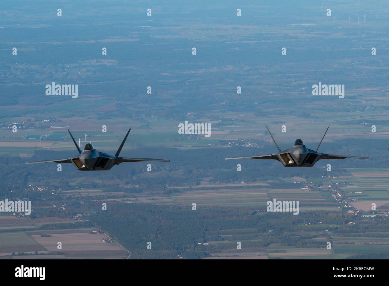 Two U.S. Air Force F-22 Raptors assigned to the 90th Expeditionary ...