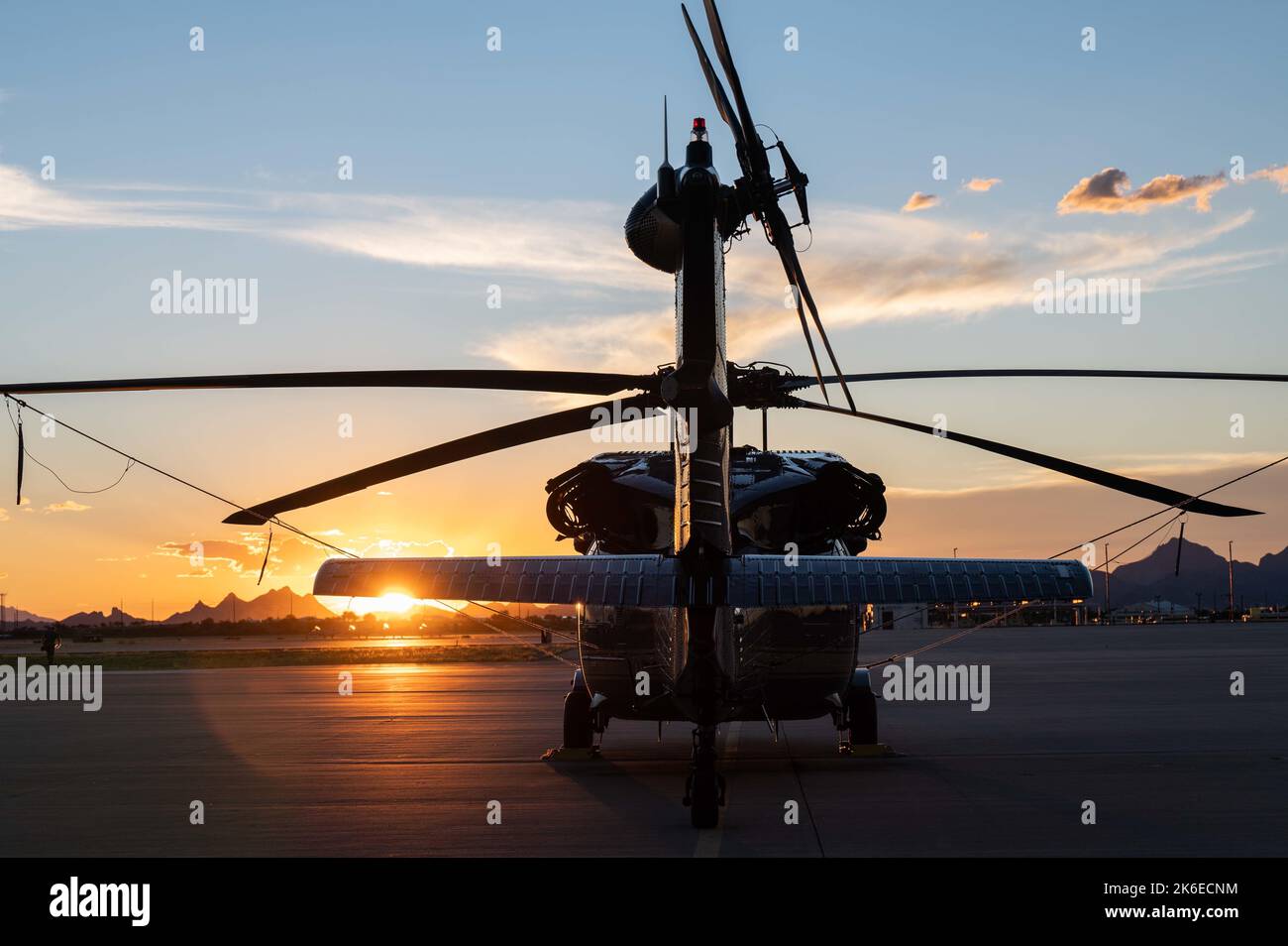 A U.S. Customs and Border Protection helicopter sits on the flightline ...