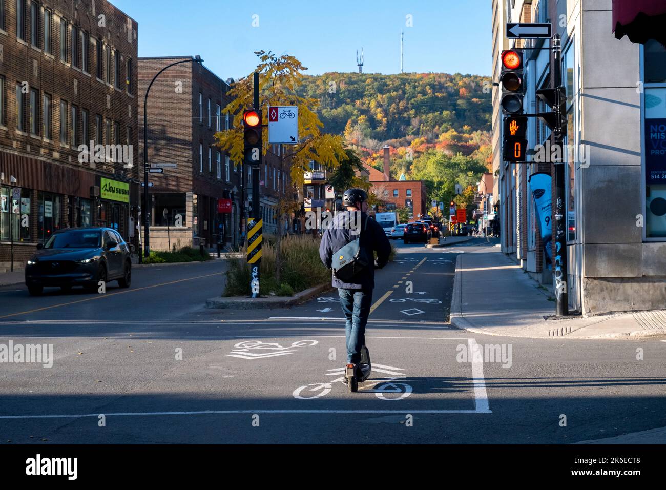 Montreal, Canada - 11 October 2022: Man on e-scooter on Rachel Street ...