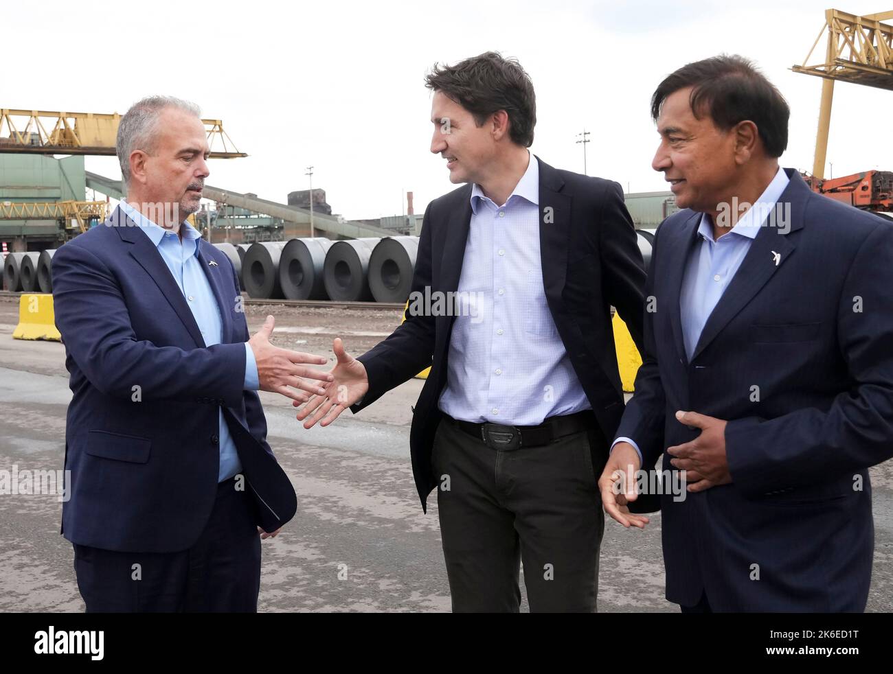 Canadian Prime Minister Justin Trudeau, centre, shakes hands with Sean Donnelly, left ...
