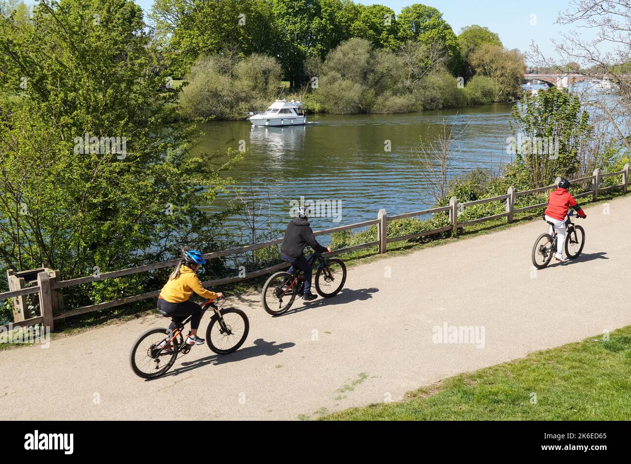 People enjoying sunny spring day on Thames path in Hampton, Richmond ...