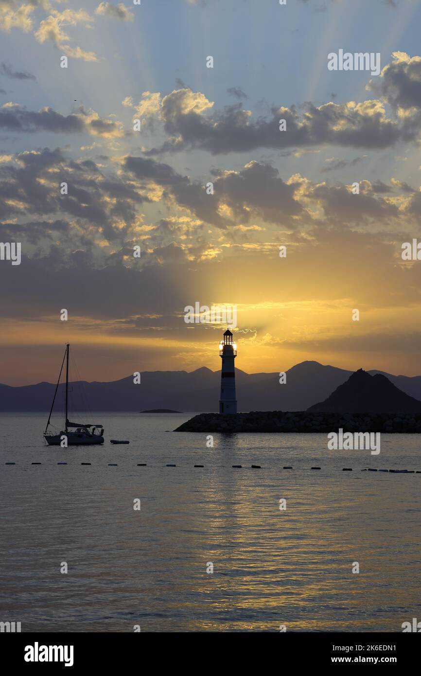 Seascape at sunshine. Lighthouse and sailings on the coast. Seaside ...