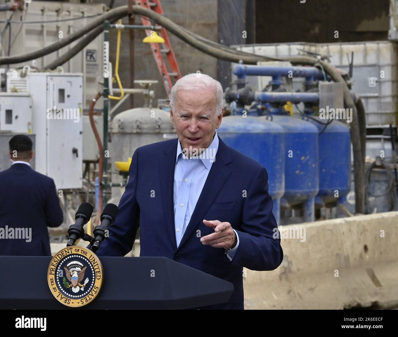 A secret service agent secures the area as he awaits President Joe ...