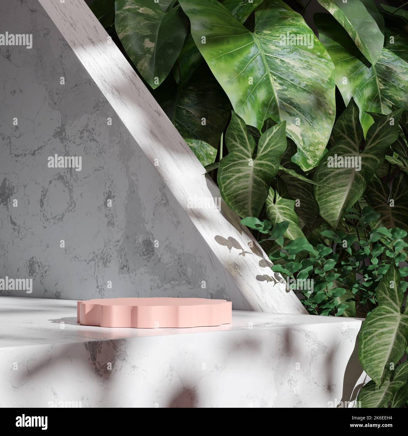 A closeup of a beautiful plant arrangement with marble stones on a pale ...