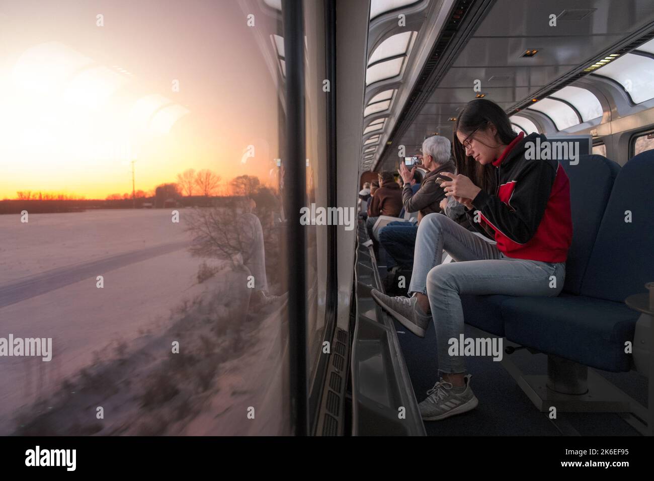 Amtrak Empire Builder, girl riding a train across Wisconsin, USA ...