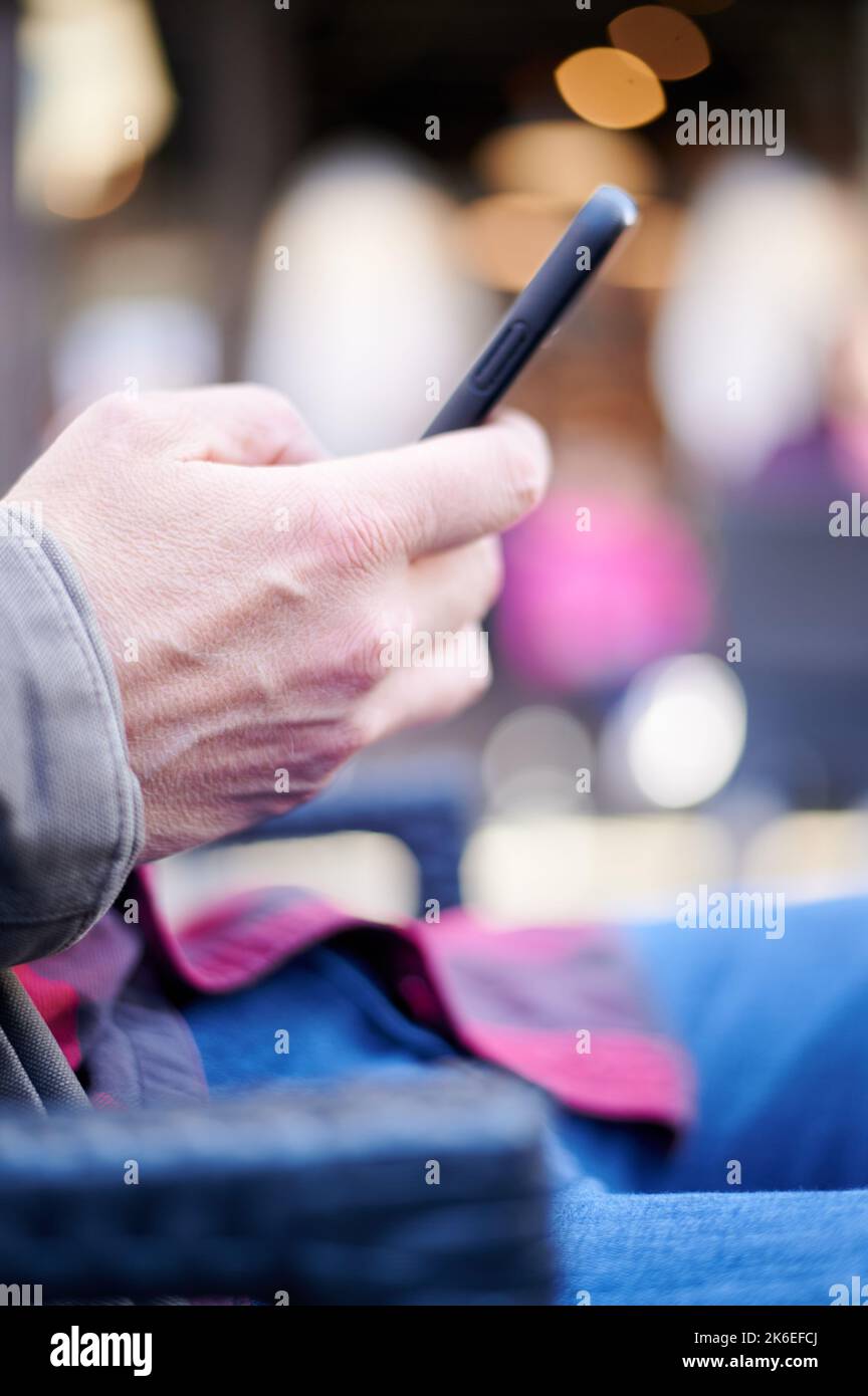 white caucasian male hand holding black mobile smart phone Stock Photo ...