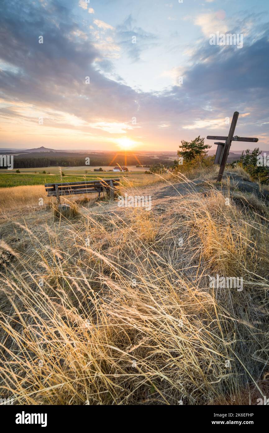 A beautiful view of a mountain peak vantage point with a summit cross ...