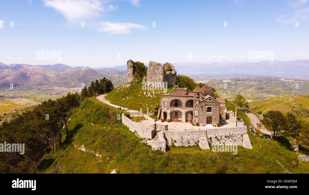 A beautiful view of a ruined castle on a hill with green trees Stock ...