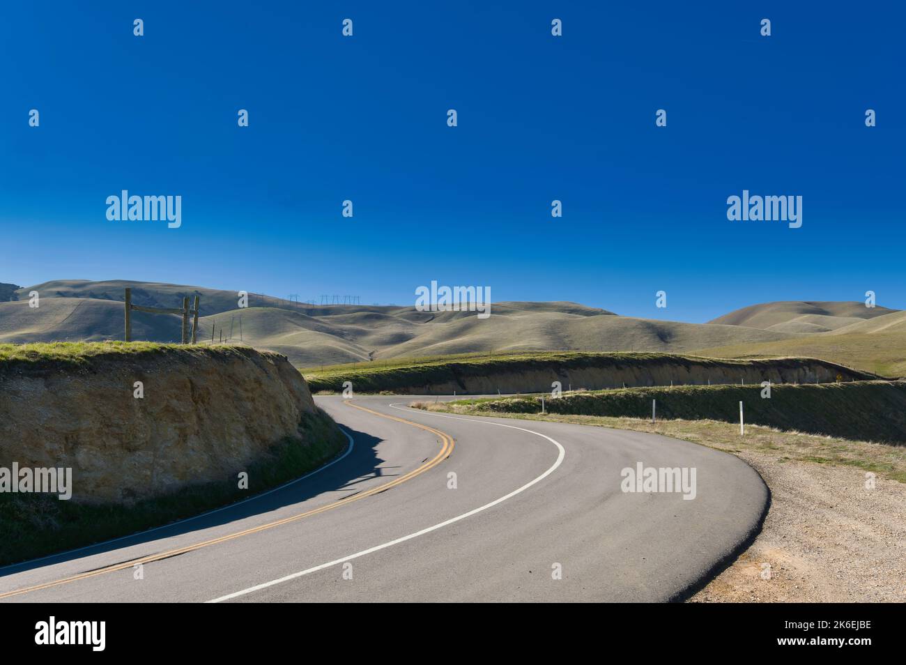 A scenic view of a Winding road going through a landscape in the ...