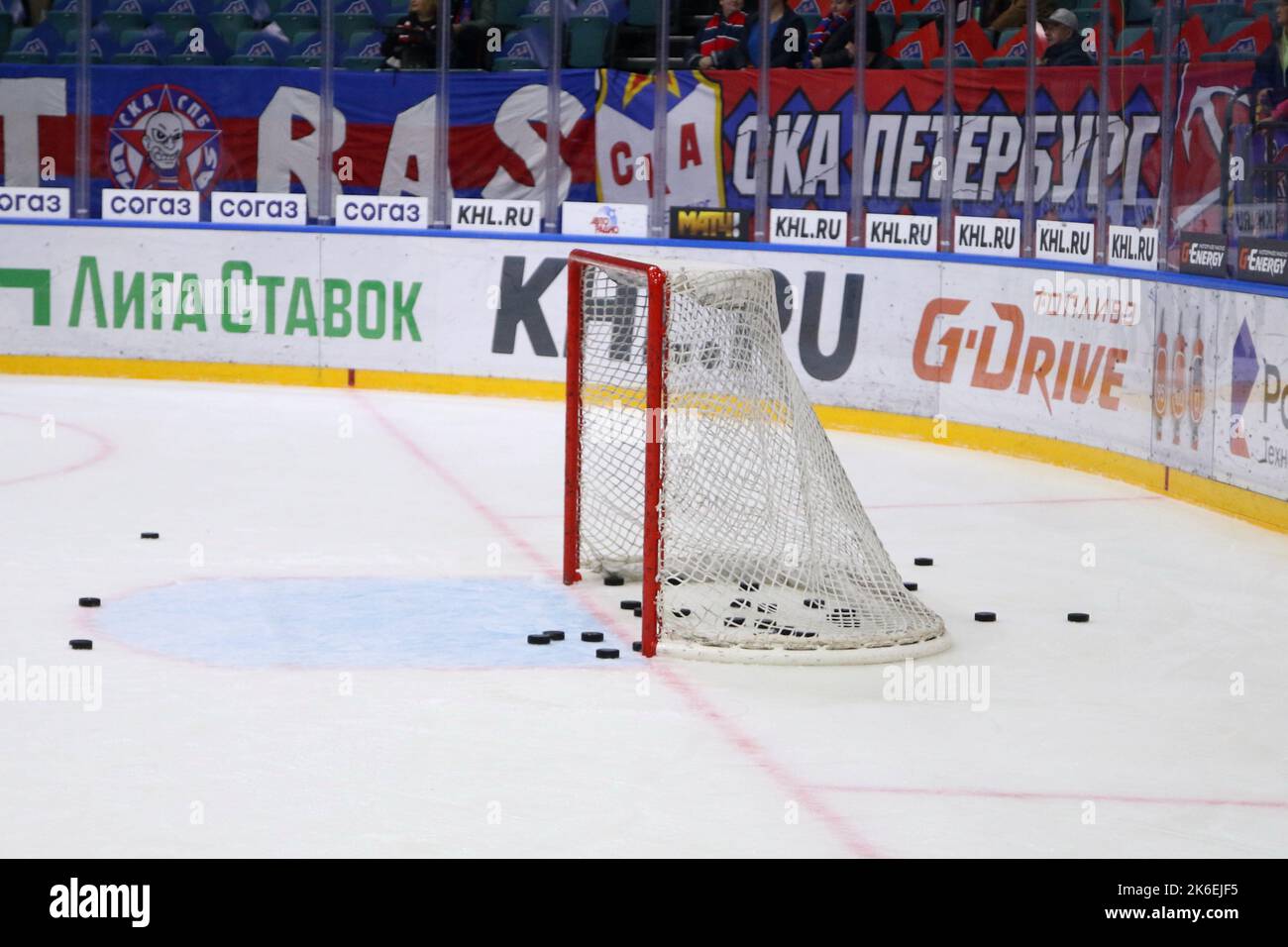A lot of pucks in an empty goal in action during the Kontinental Hockey ...