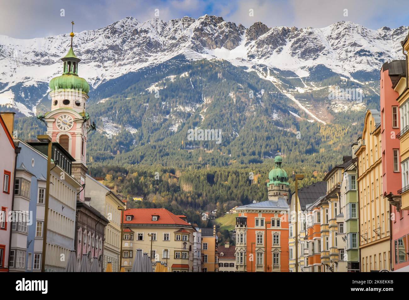 Innsbruck Old town and snowcapped karwendel mountain at sunset in Tyrol ...