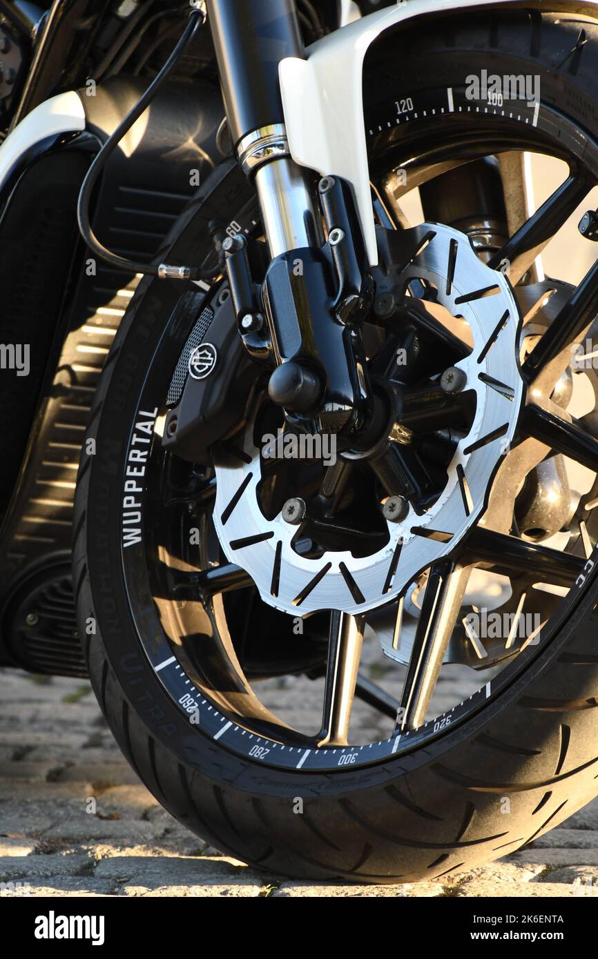 A vertical closeup of a front wheel of a chopper motorcycle Stock Photo ...