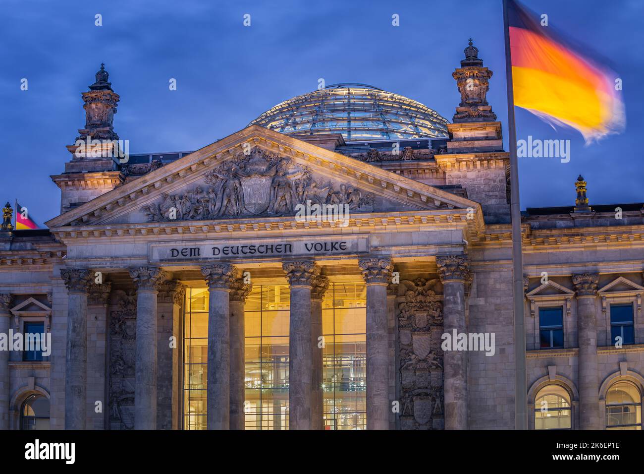 Reichstag building, seat of the German Parliament with national flag ...