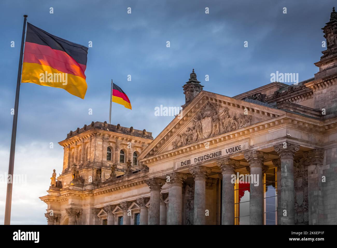 Reichstag building, seat of the German Parliament with national flag ...