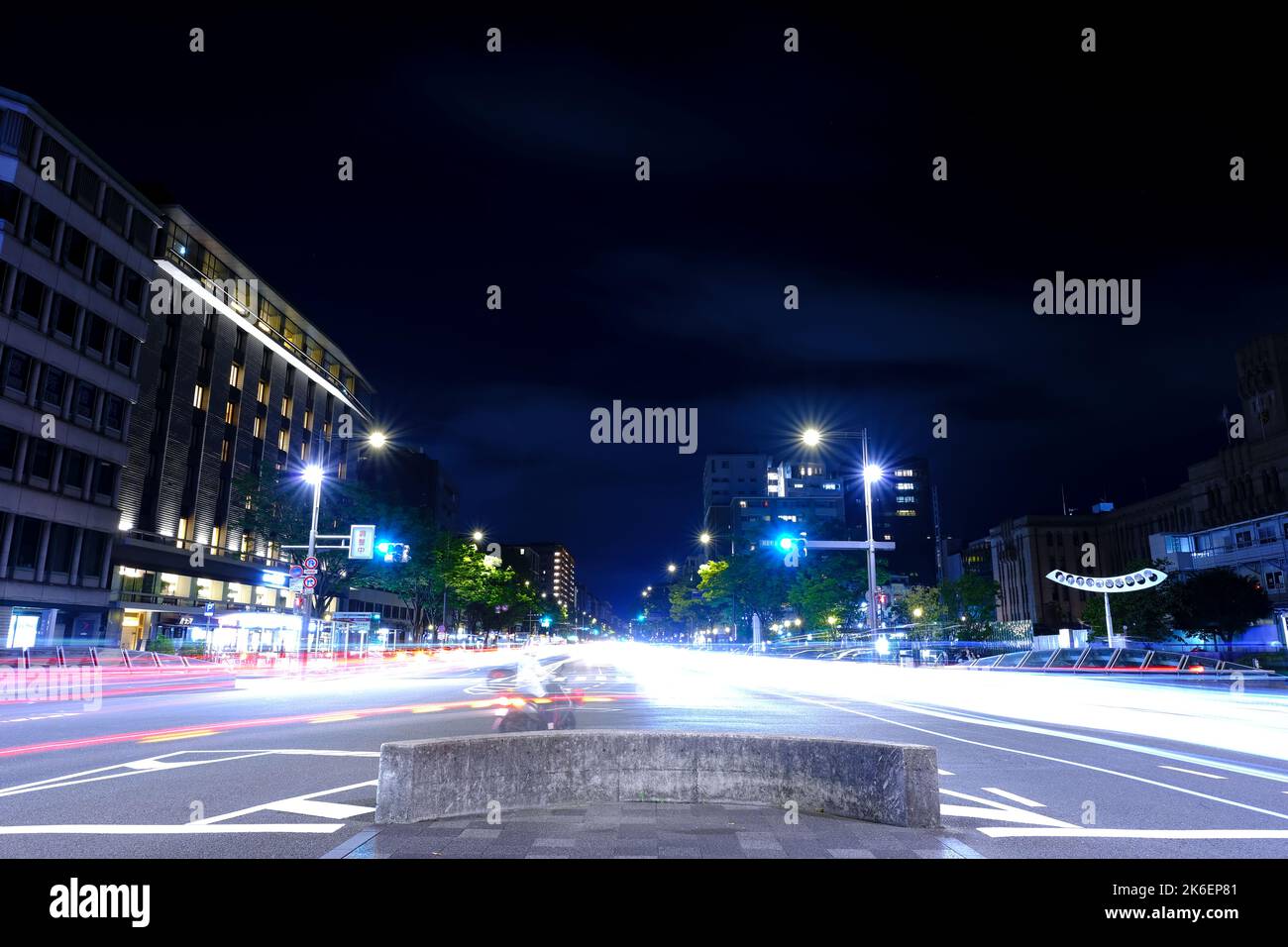 Double long exposure of a busy intersection in downtown Kyoto at night ...