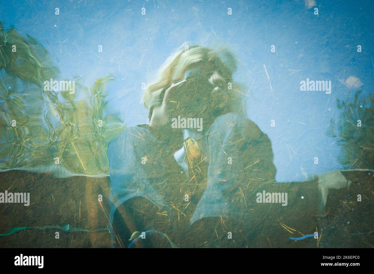 Woman taking selfie in the water reflection Stock Photo - Alamy