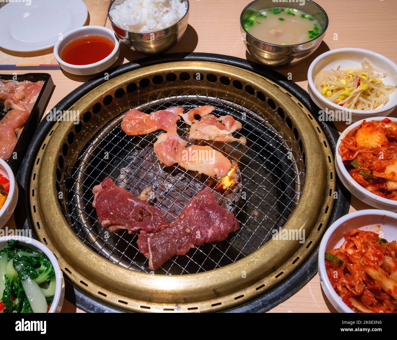 Korean BBQ restaurant, grilling Chicken and Beef Stock Photo - Alamy