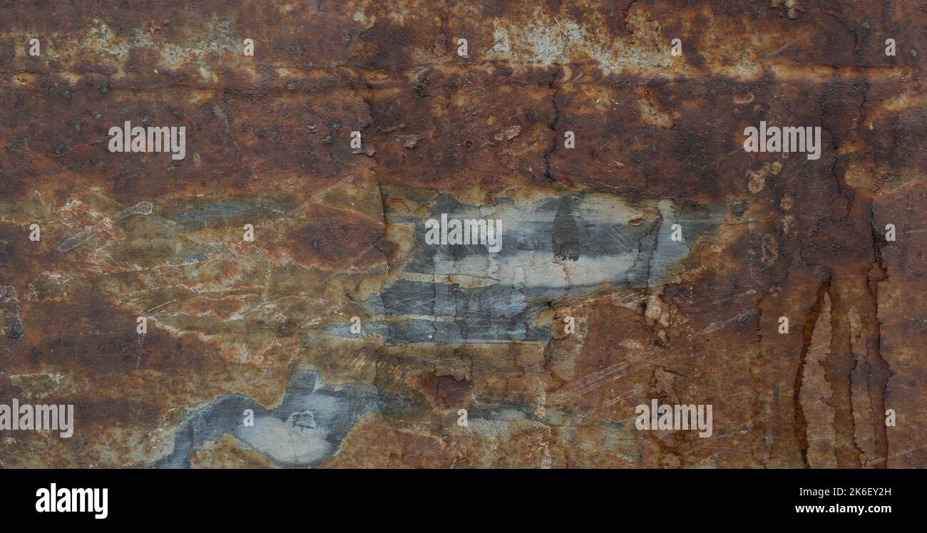 Brown rust stain on the black with blue with green with gray and silver ...