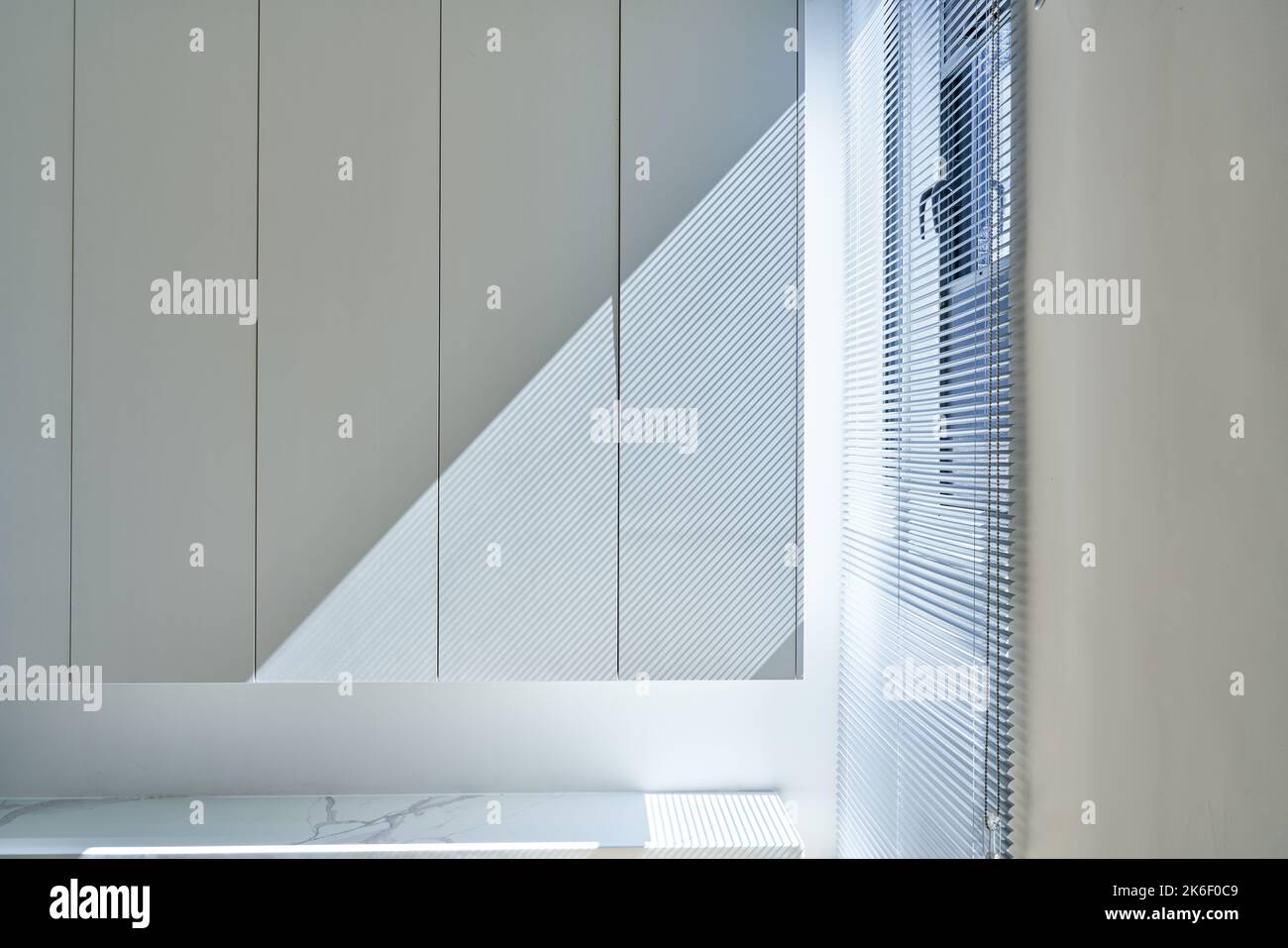 A ray of sunlight hits a white locker in a modern home renovation Stock ...