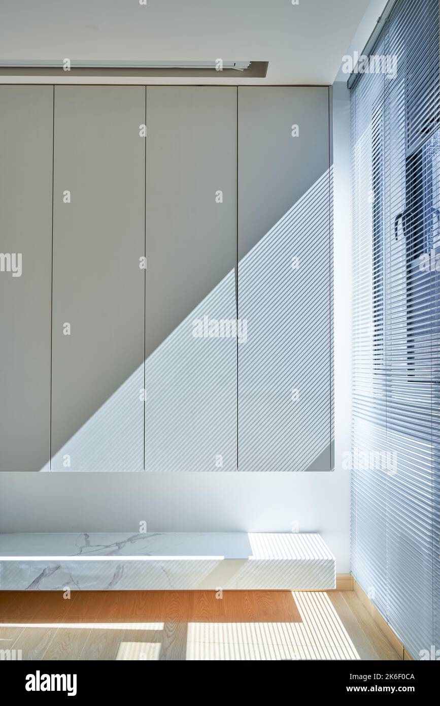 A ray of sunlight hits a white locker in a modern home renovation Stock ...
