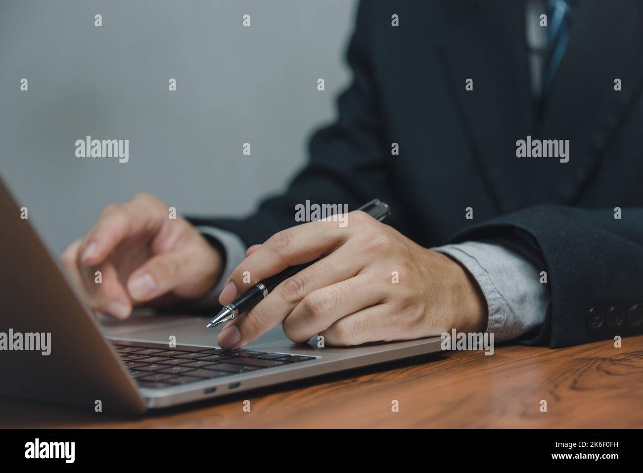Close up man working and typing on laptop computer keyboard Work from ...