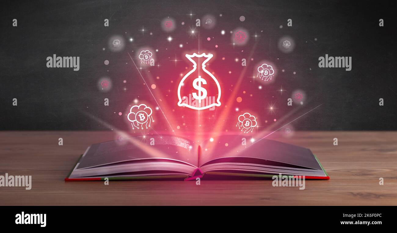 Open book with currency icons above Stock Photo - Alamy