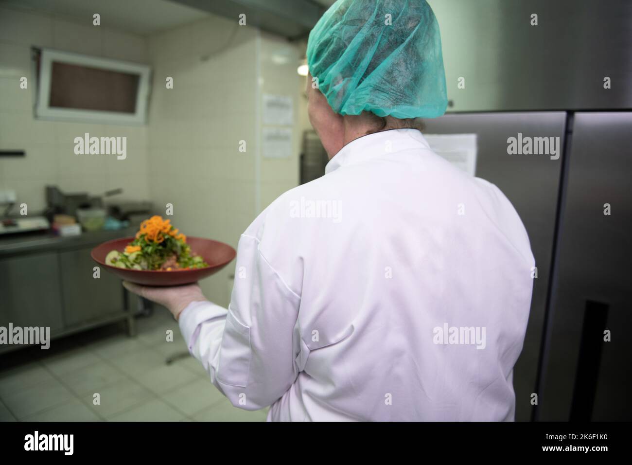 Chef in the Kitchen of the Hotel or Restaurant Showing the Food Just ...