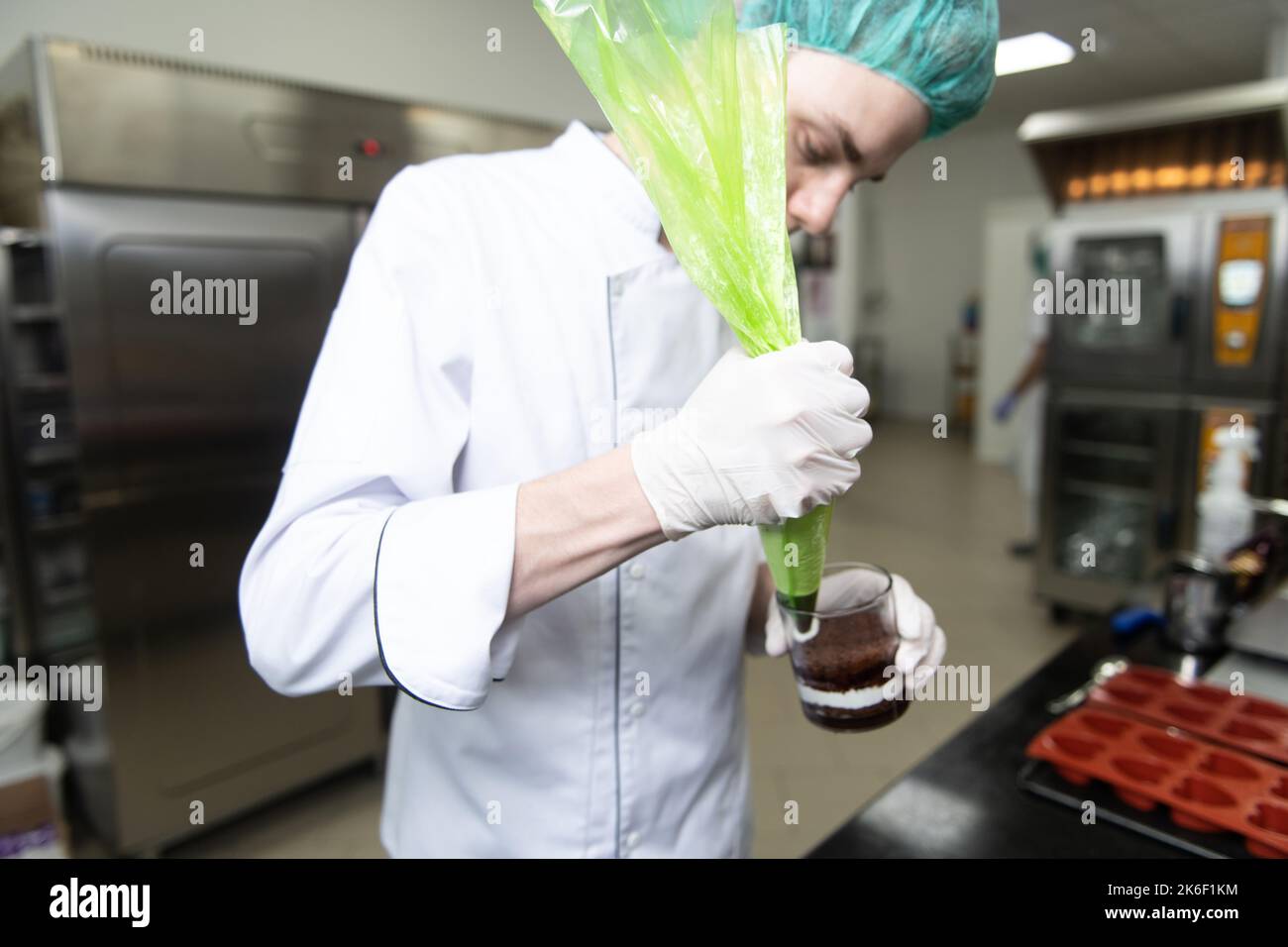 Chef Hold Glass Made from Chocolate and Cream Stock Photo - Alamy
